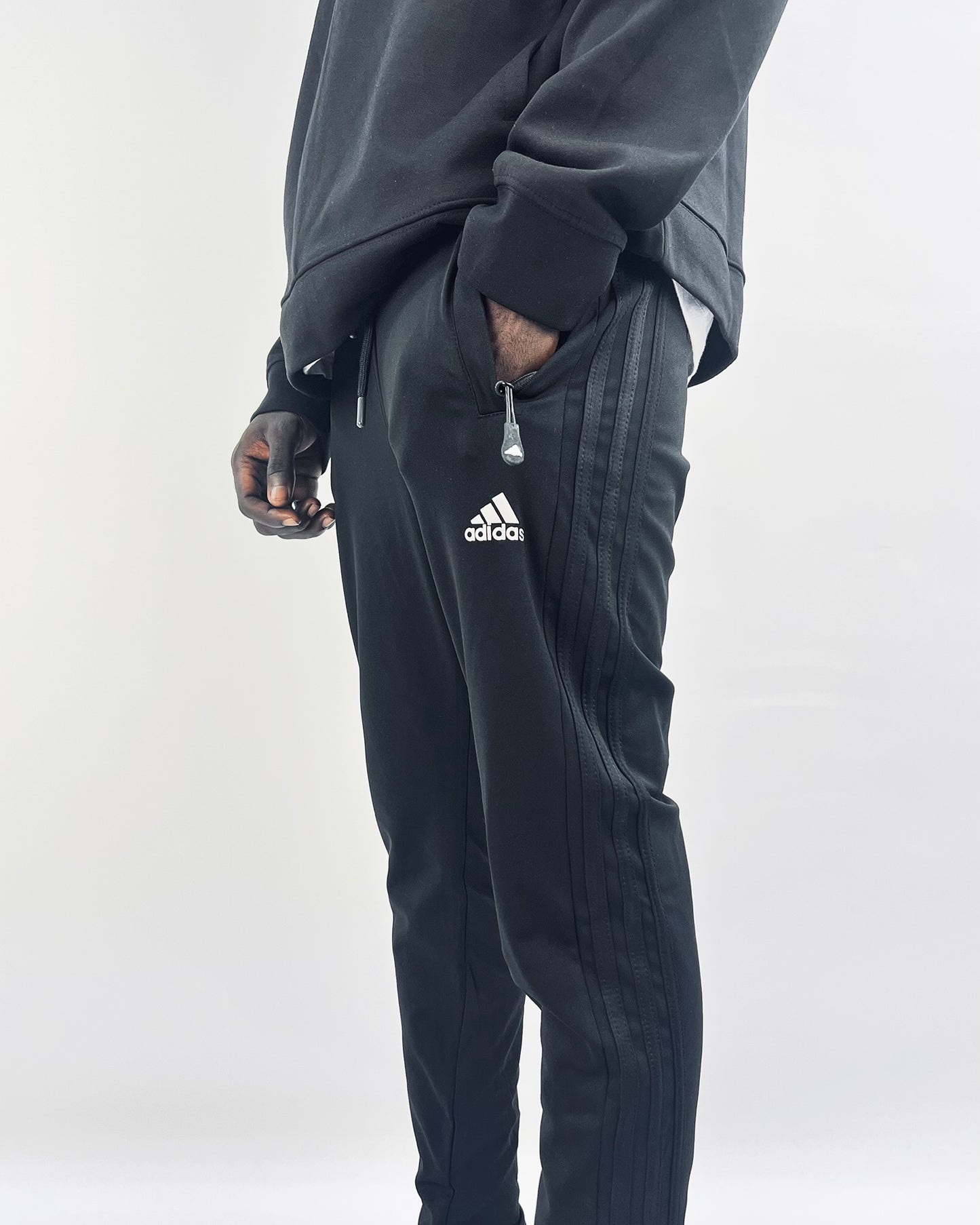 Adidas reflective logo track pants in black – Garmisland