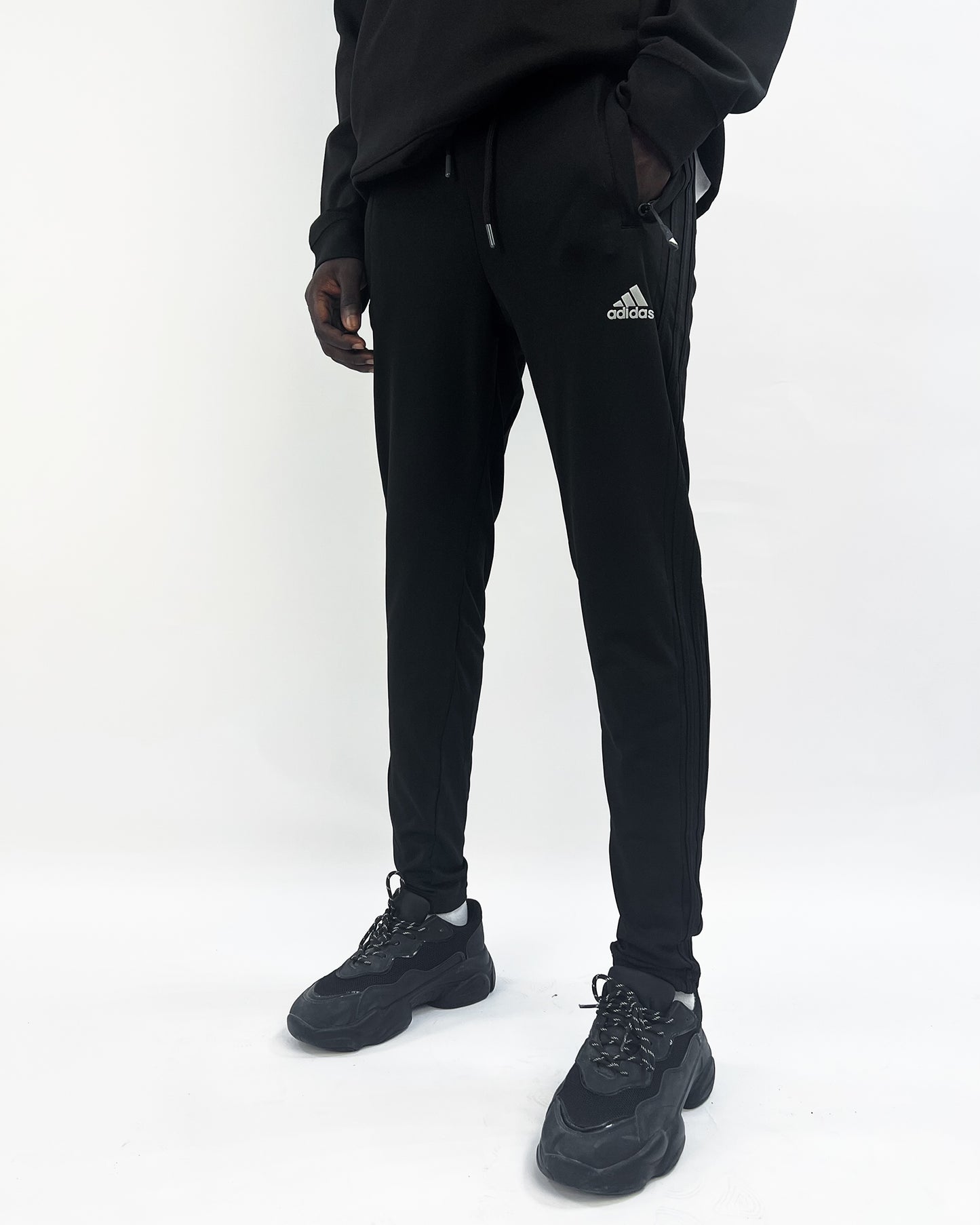 Adidas reflective logo track pants in black – Garmisland