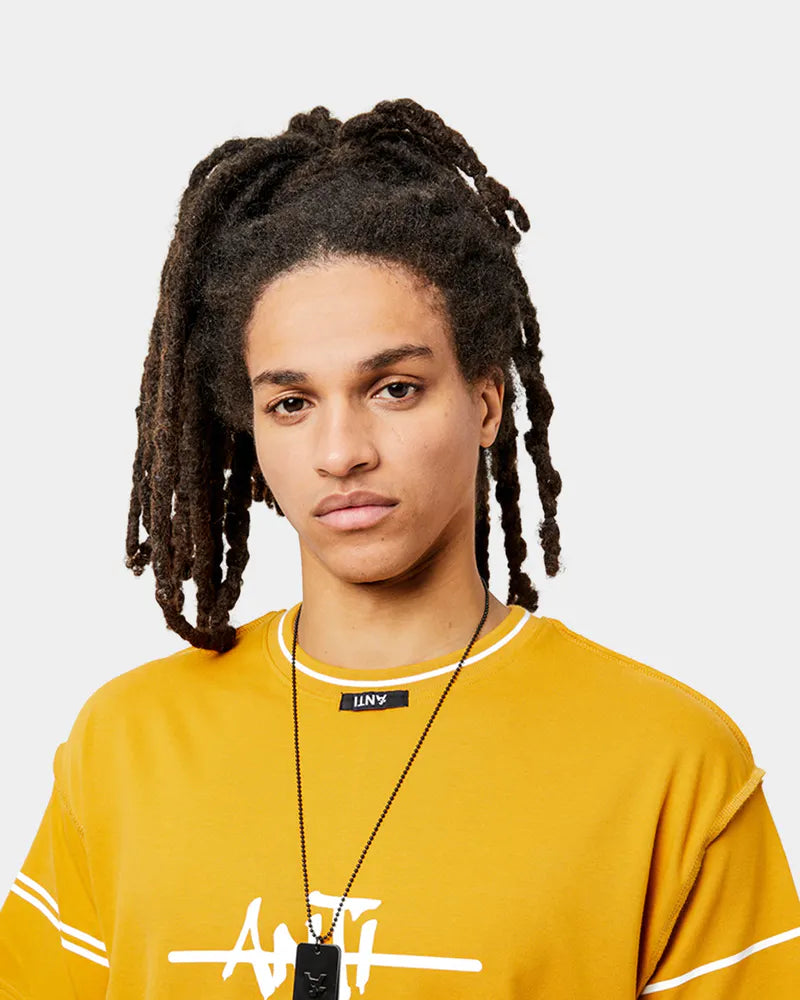 The Anti Order Logo Man Made T-Shirt in mustard – Garmisland